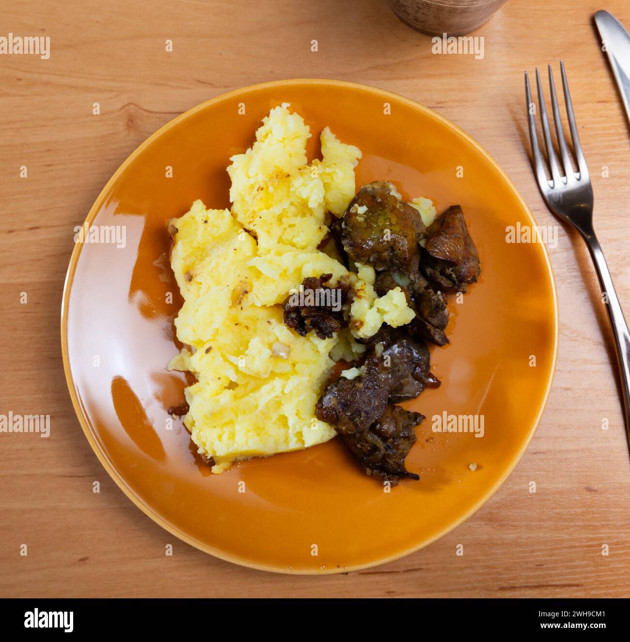 Mashed puree potatoes with fried chicken liver as main course Stock ...