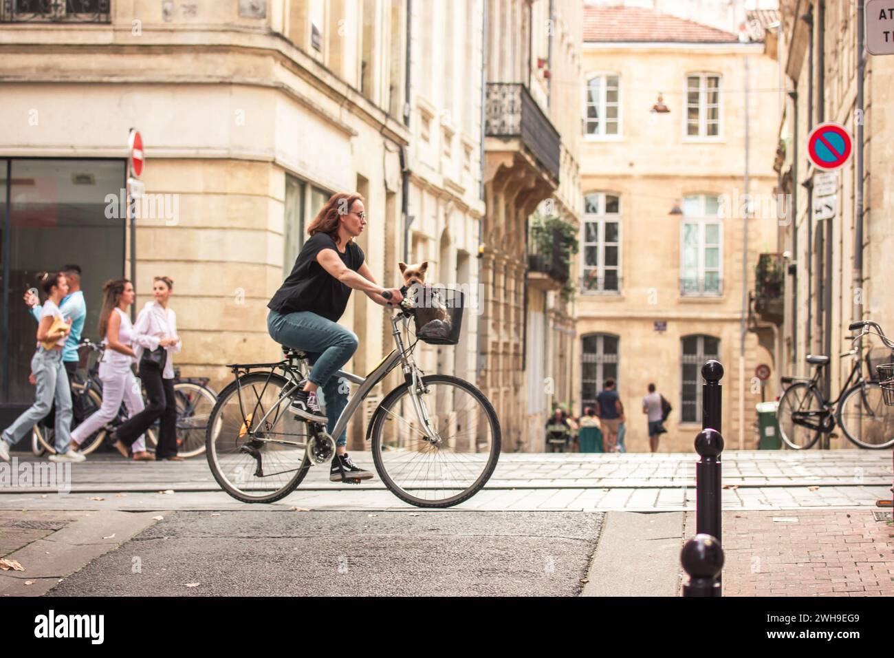 Bordeaux, France. October 8, 2023 European woman riding a bicycle with ...