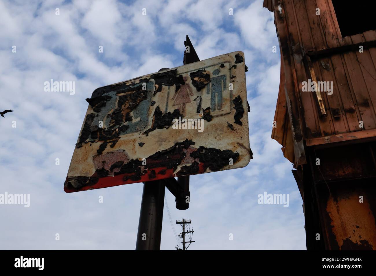 A road sign left burnt to the ground at Wajima Asaichi, a tourist ...