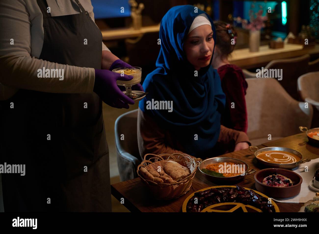 In a heartwarming scene, a professional chef serves an European Muslim ...