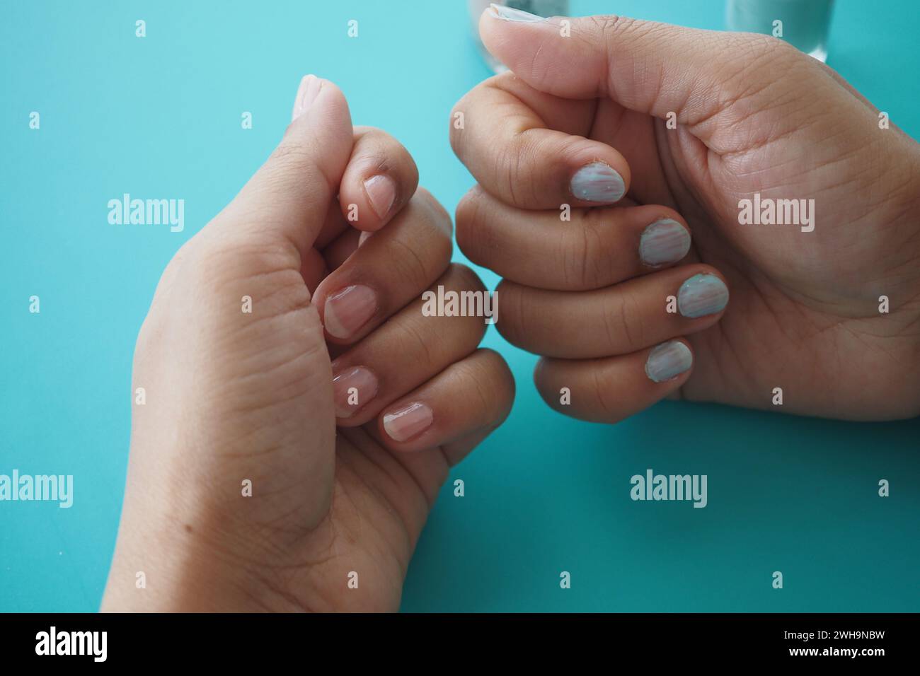 putting nail polish on nail Stock Photo - Alamy