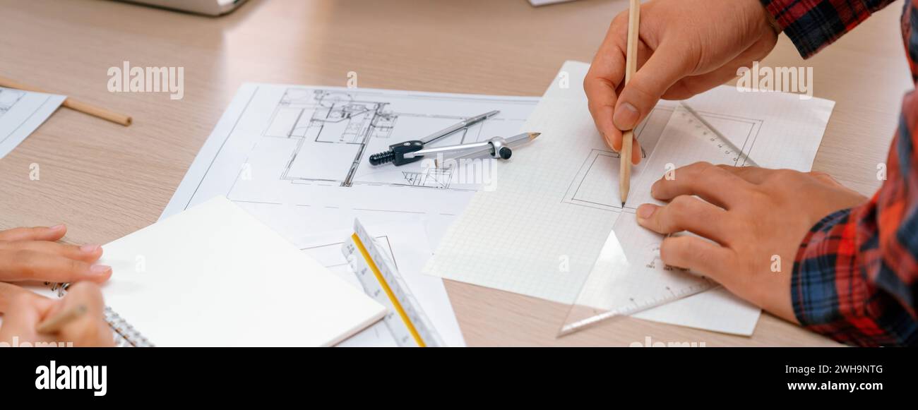 Professional architect hand drawing a blueprint by using ruler ...