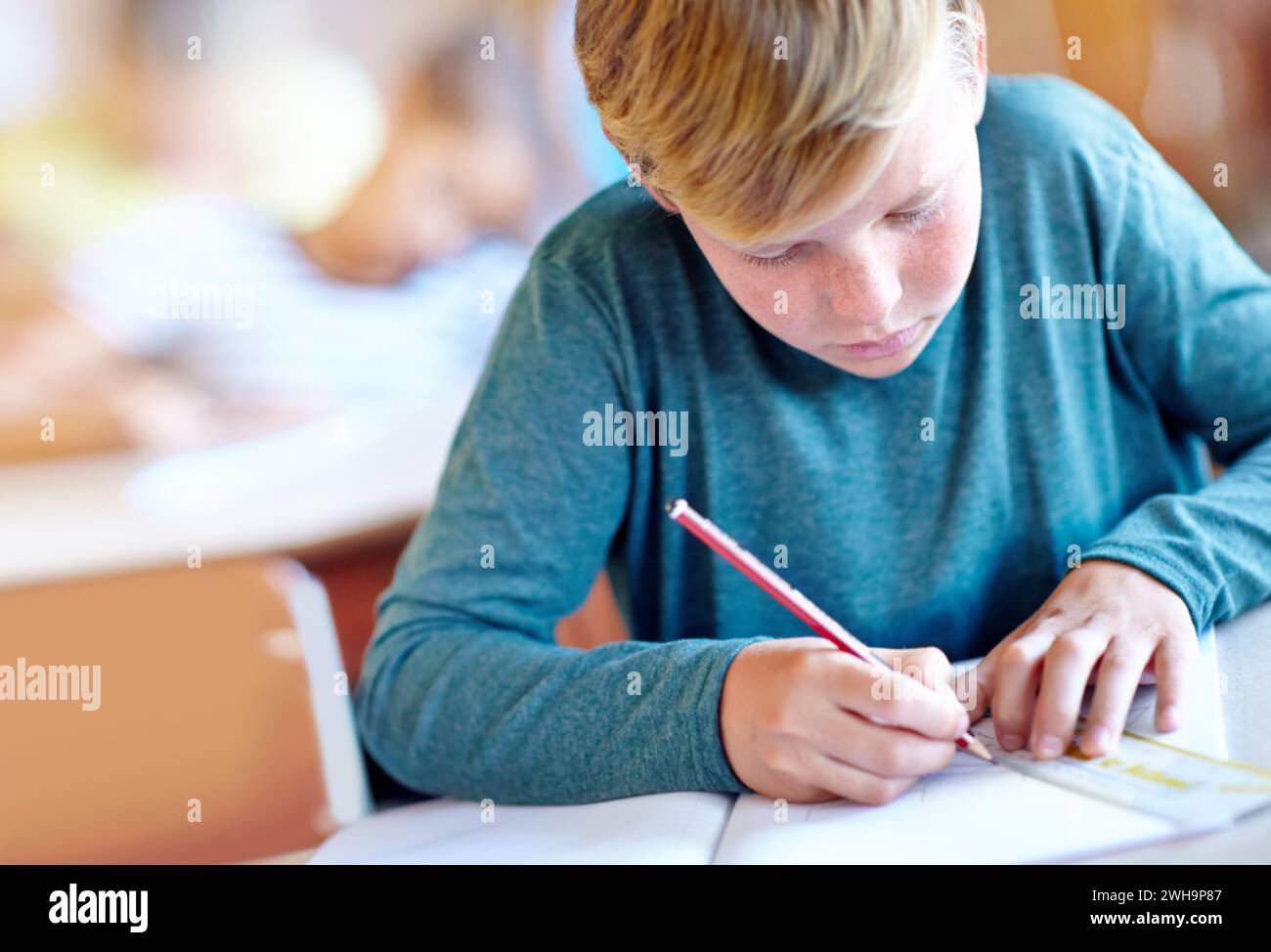 Student, boy and drawing for learning in classroom, book and problem ...