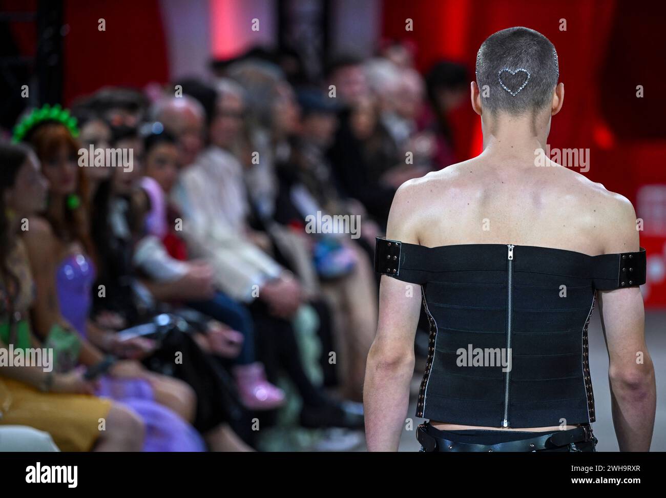 08 February 2024, Berlin: A model with a heart in her hair can be seen ...