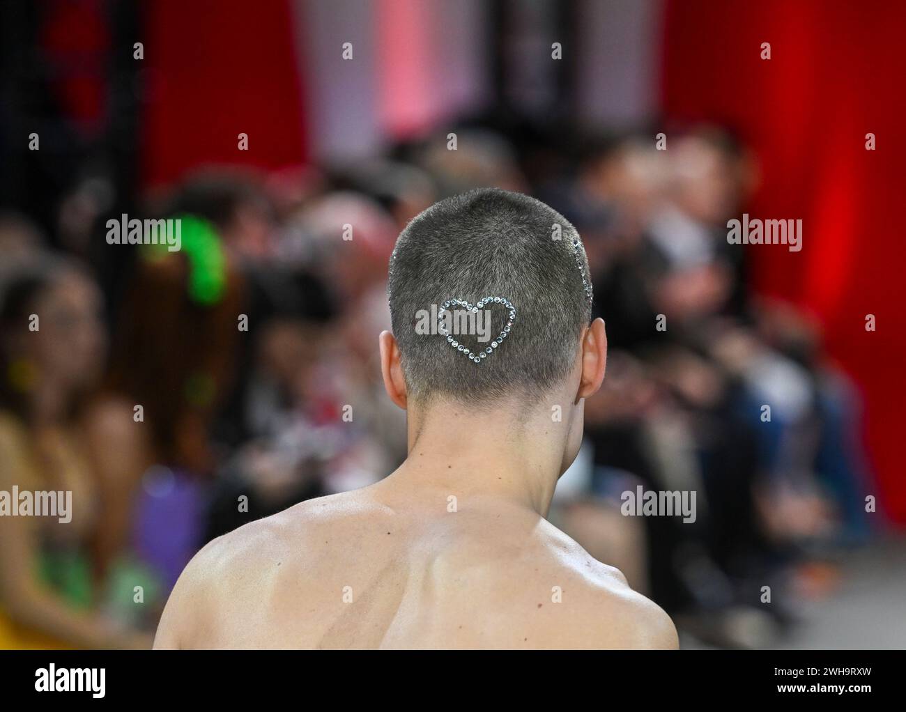 08 February 2024, Berlin: A model with a heart in her hair can be seen ...