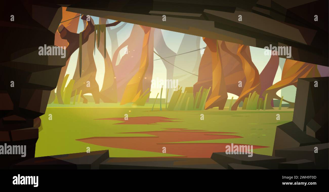 View from inside cave on forest with tree trunks and green grass on ...