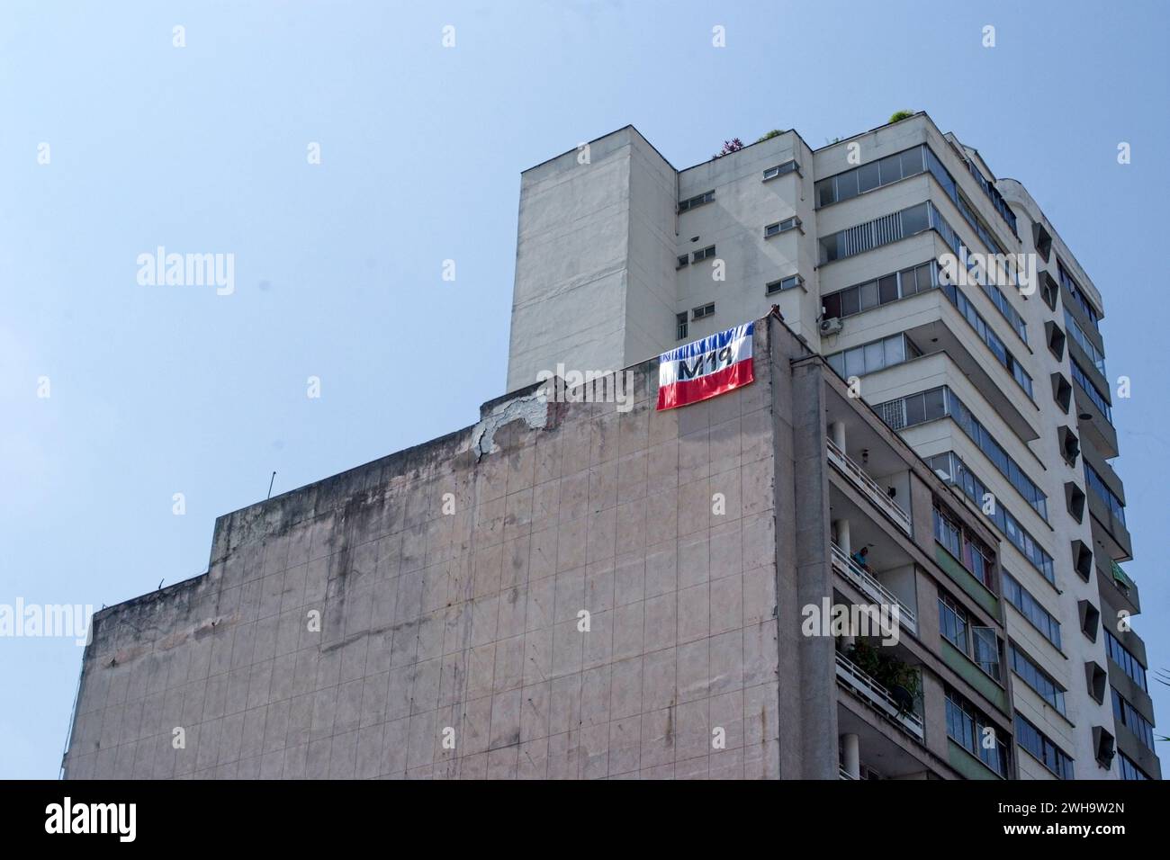 A M-19 Former guerrilla flag is hanged from a building during a ...