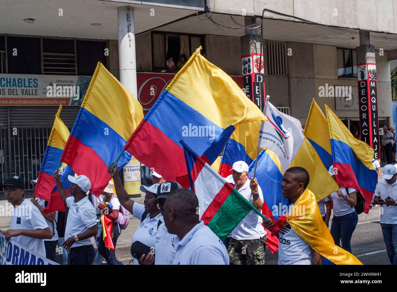 Colombians demonstrate with signs and flags during a protest demanding ...