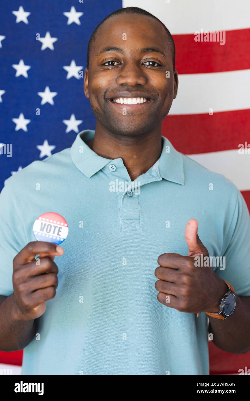 Young African American man shows his support for democracy with a 'vote ...