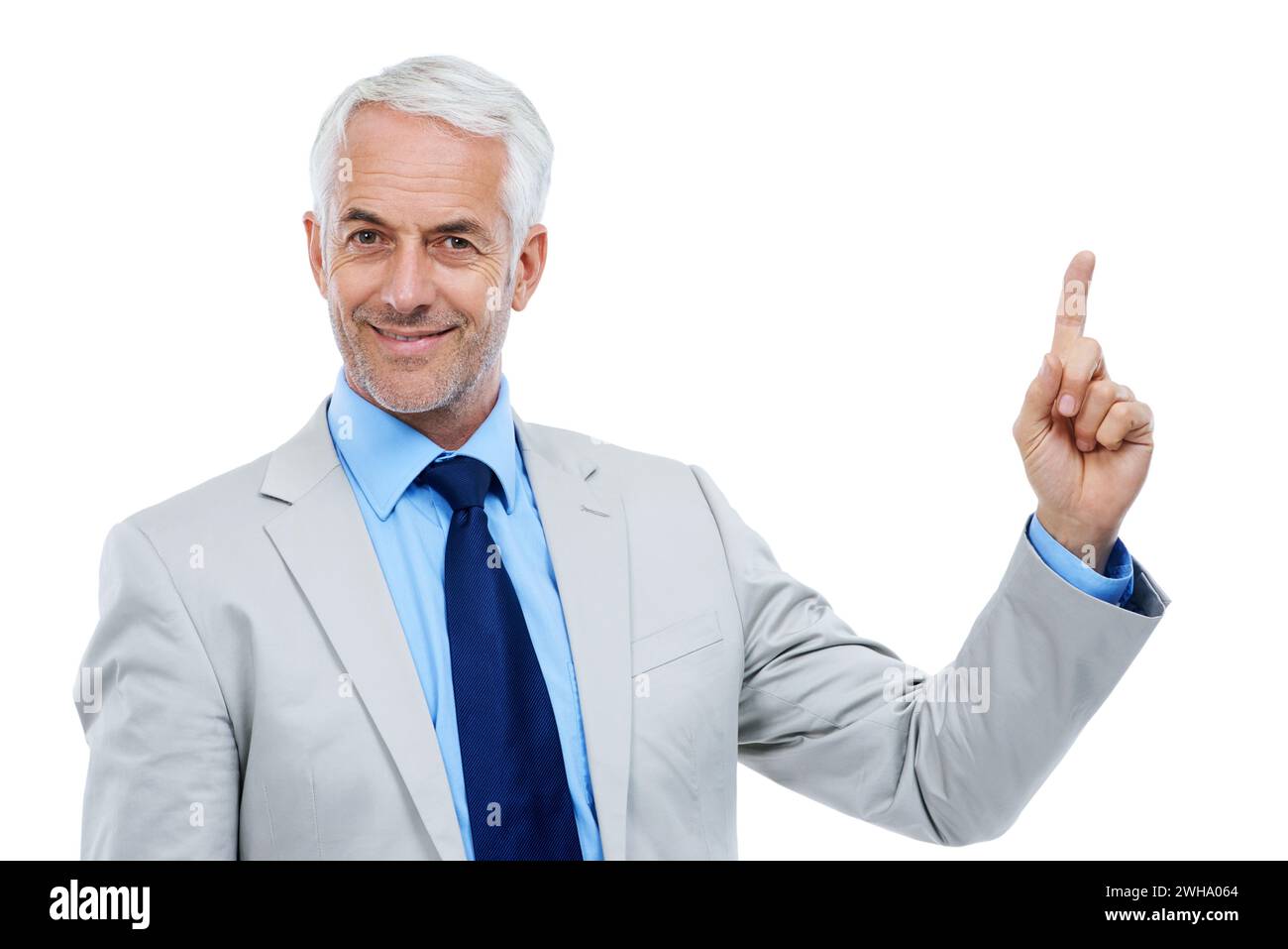 Senior man, pointing and portrait with suit in studio, white background ...