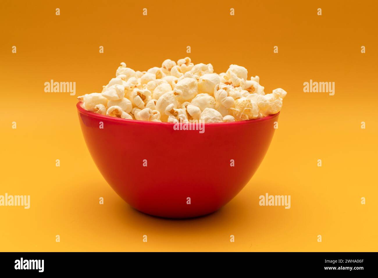 National Popcorn Lover's Day. Popcorn in Red Bowl on Yellow Background ...