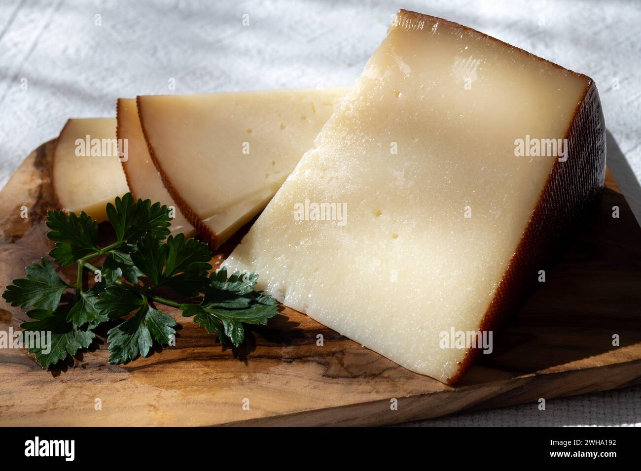 Spanish hard manchego, cow, sheep and goat cheese close up Stock Photo ...