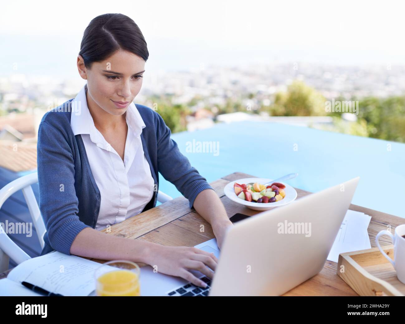 Swimming pool, business and woman with a laptop, typing and connection ...