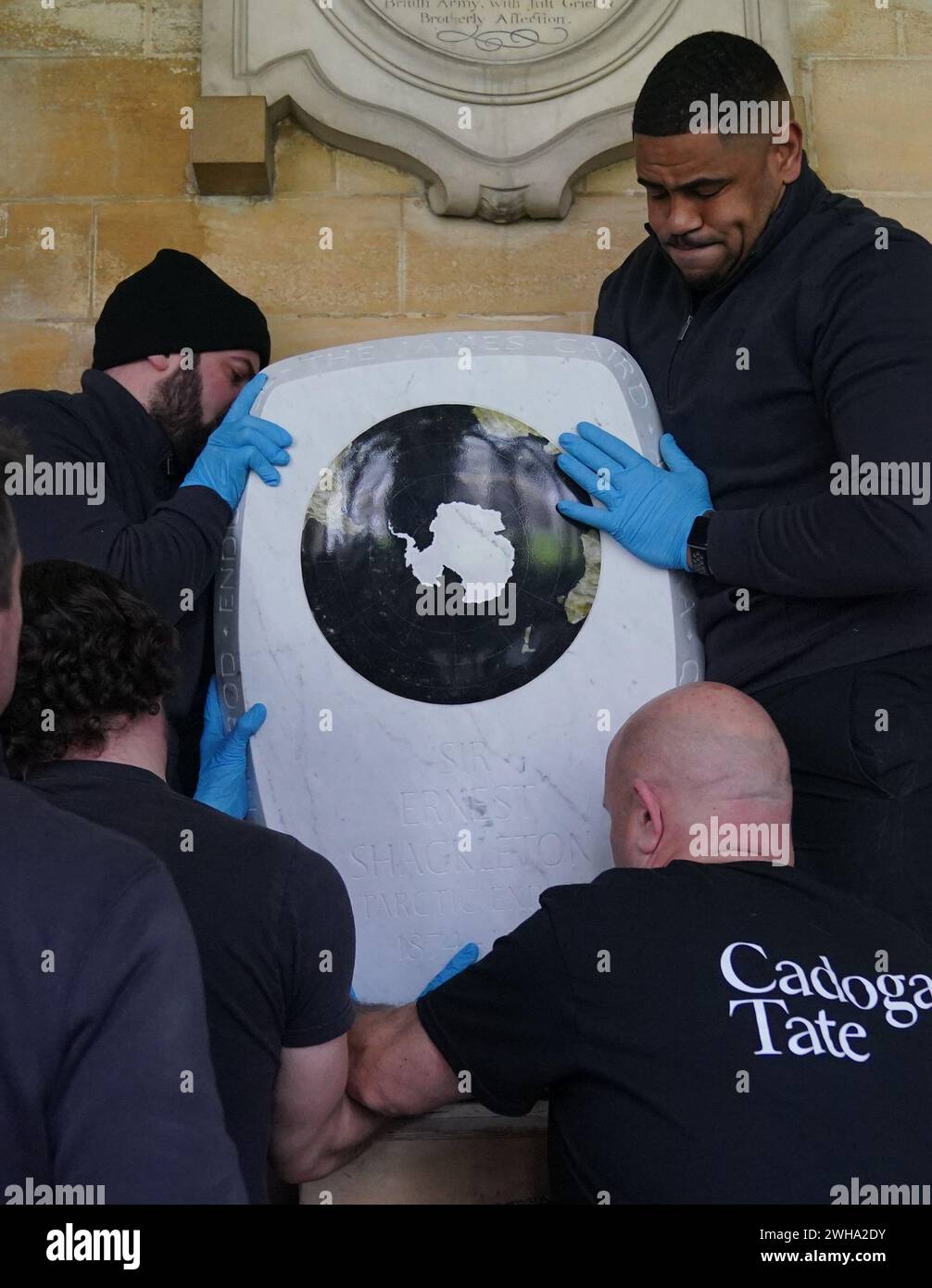 Workers put the memorial stone for Sir Ernest Shackleton into place in ...