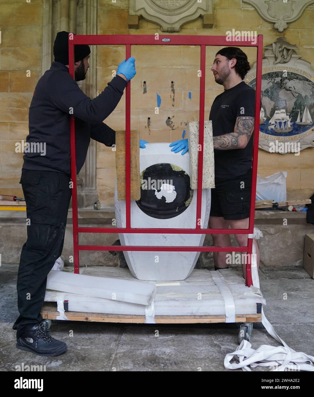 Workers put the memorial stone for Sir Ernest Shackleton into place in ...