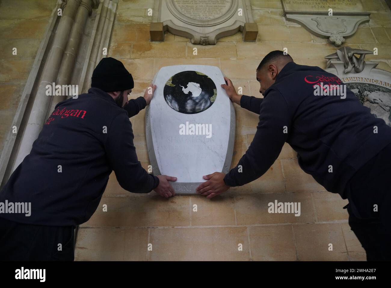 Workers put the memorial stone for Sir Ernest Shackleton into place in ...