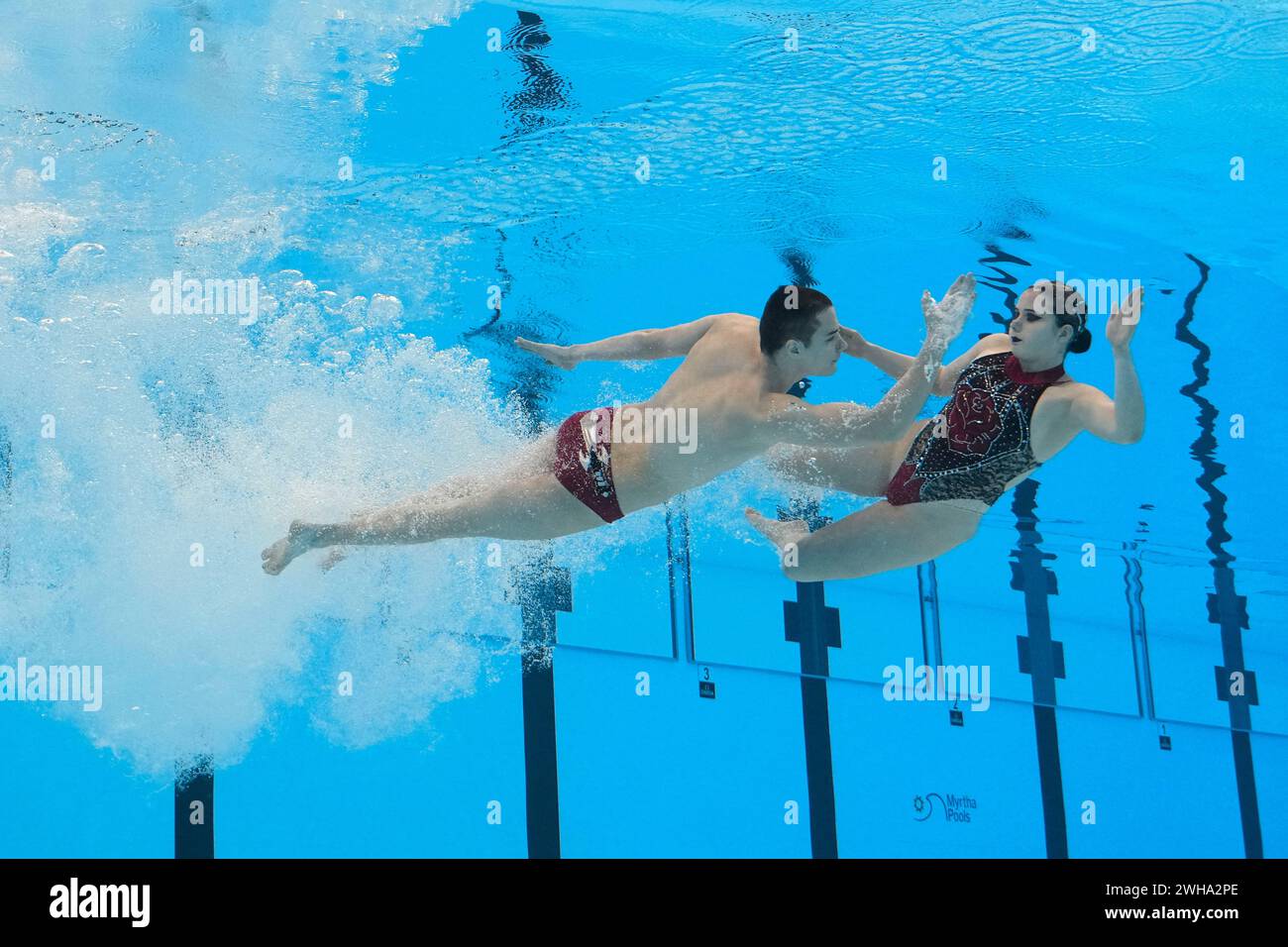 Ivan Martinovic and Jelena Kontic, of Serbia, compete in the mixed duet ...