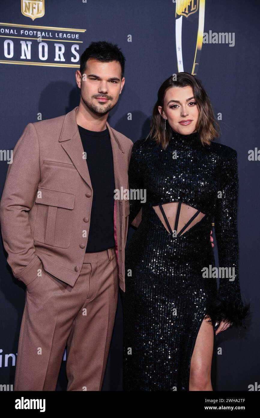 Taylor Lautner and Taylor Dome on the red carpet at the 13th annual NFL ...