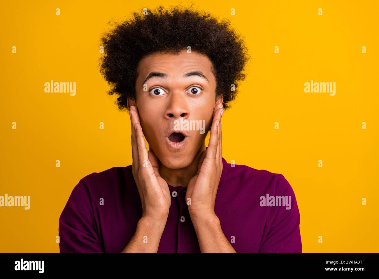 Photo of worried nervous guy open mouth two arms touch cheeks panic ...