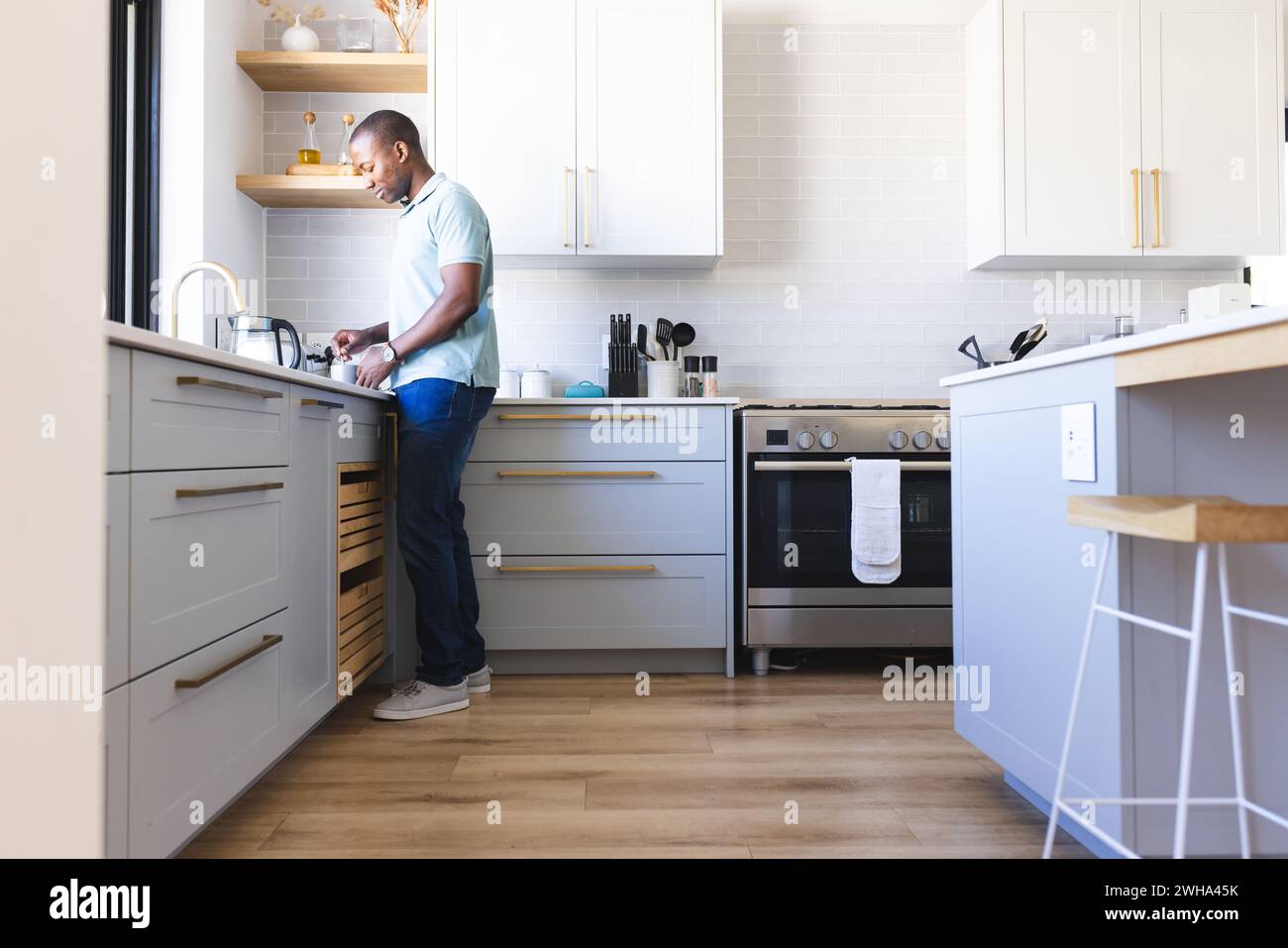 Washing dishes in modern kitchen hi-res stock photography and images ...