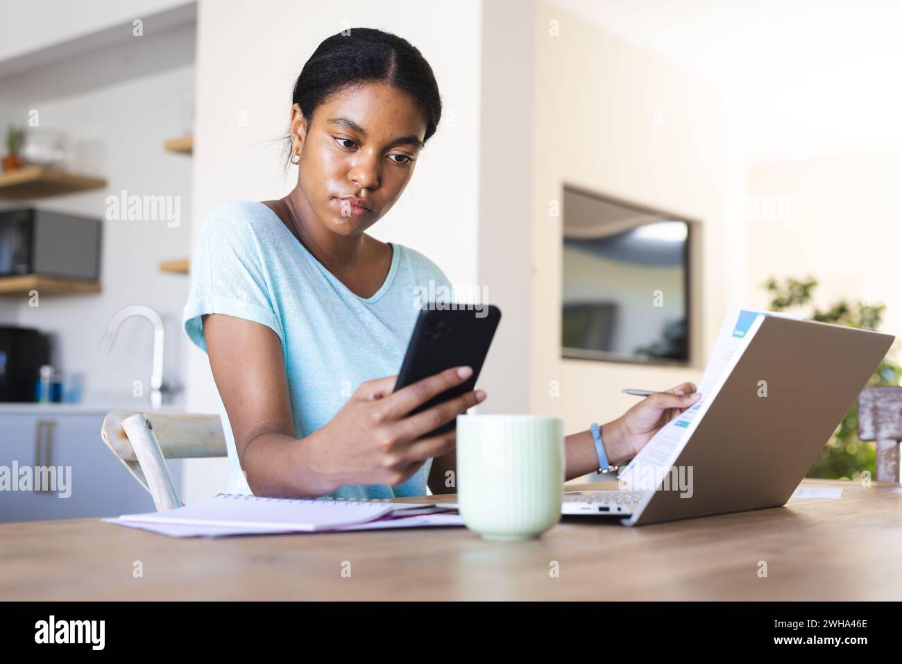 Focused young woman entrepreneur multitasking hi-res stock photography ...