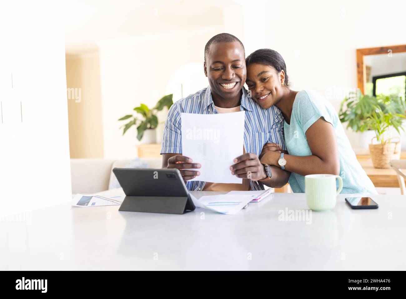 African American couple reviews finances at home, with copy space Stock ...