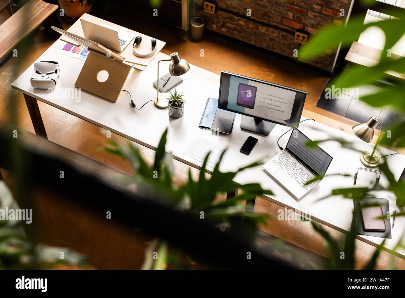 A modern office setup showcases a clean, casual business workspace. The ...