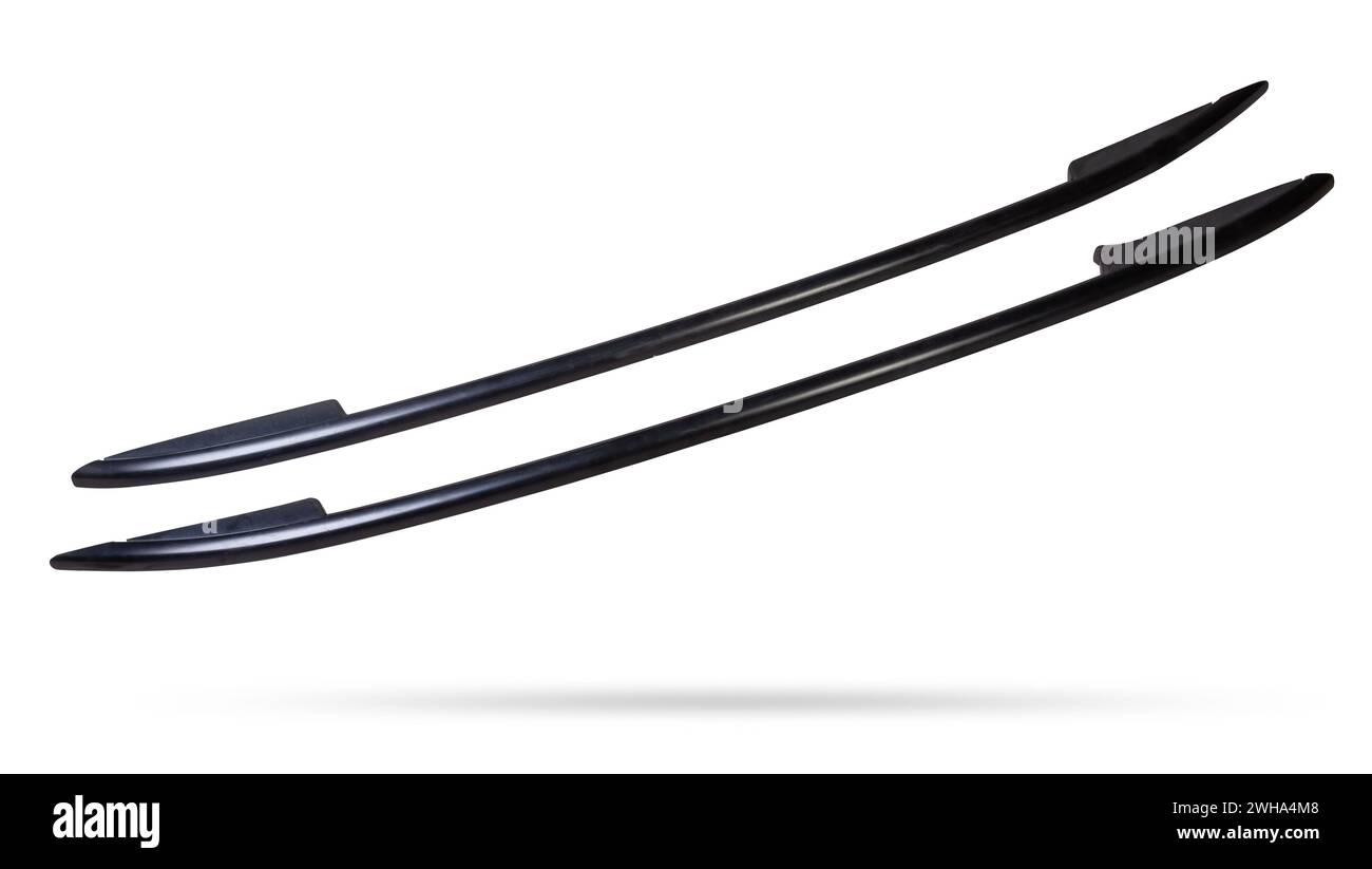 A pair of black roof rails for securing luggage on the roof of a car on ...