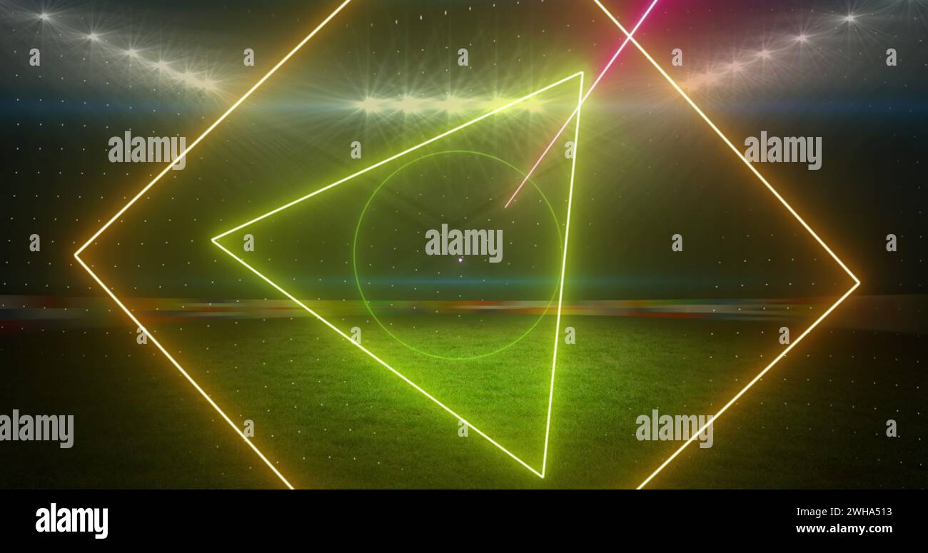 Image of rotating neon shapes and lights over floodlit sports field ...
