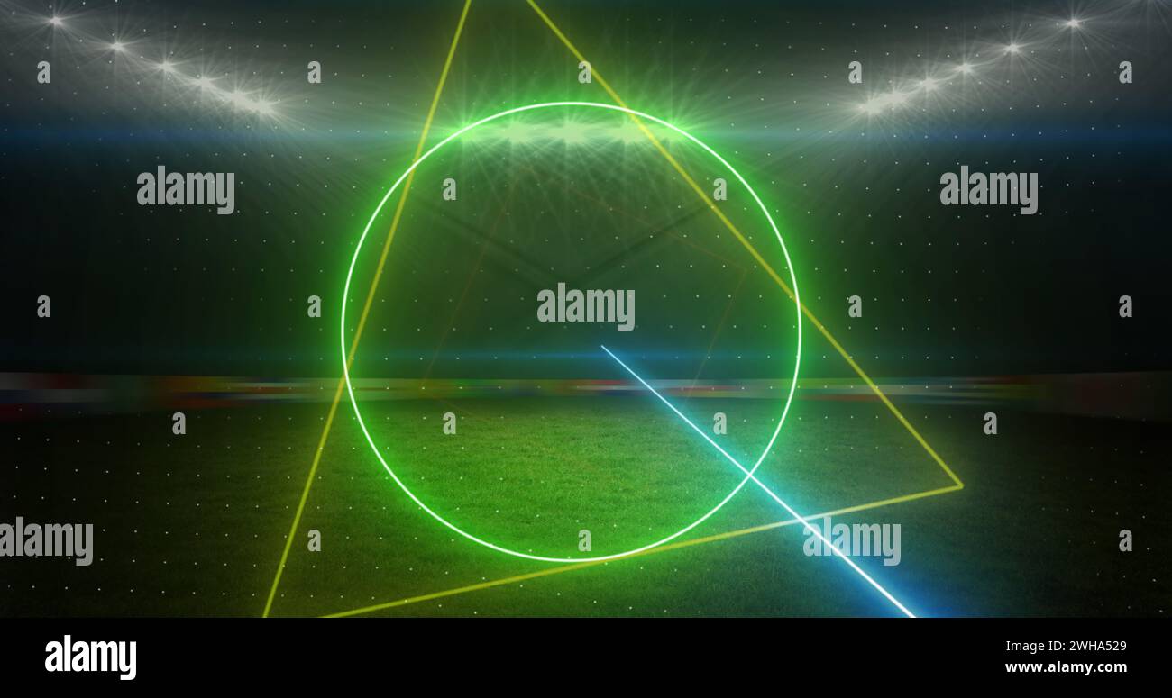 Image of rotating neon shapes and lights over floodlit sports field ...