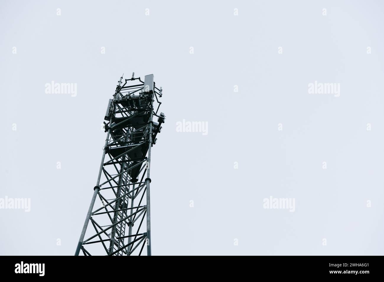 Deployment of the 5G network. Laying antennas on a mobile phone mast in ...