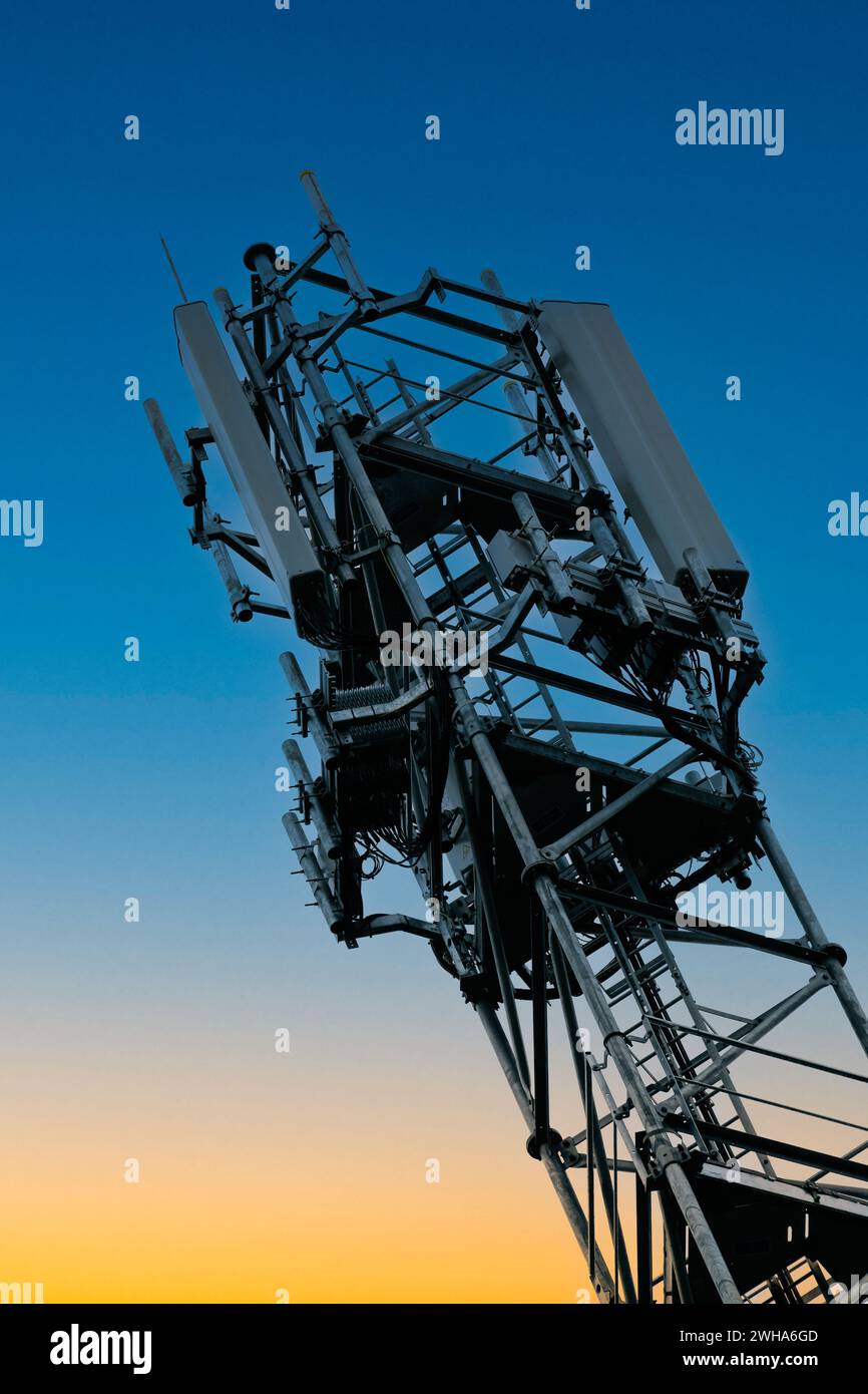 Deployment of the 5G network. Laying antennas on a mobile phone mast in ...