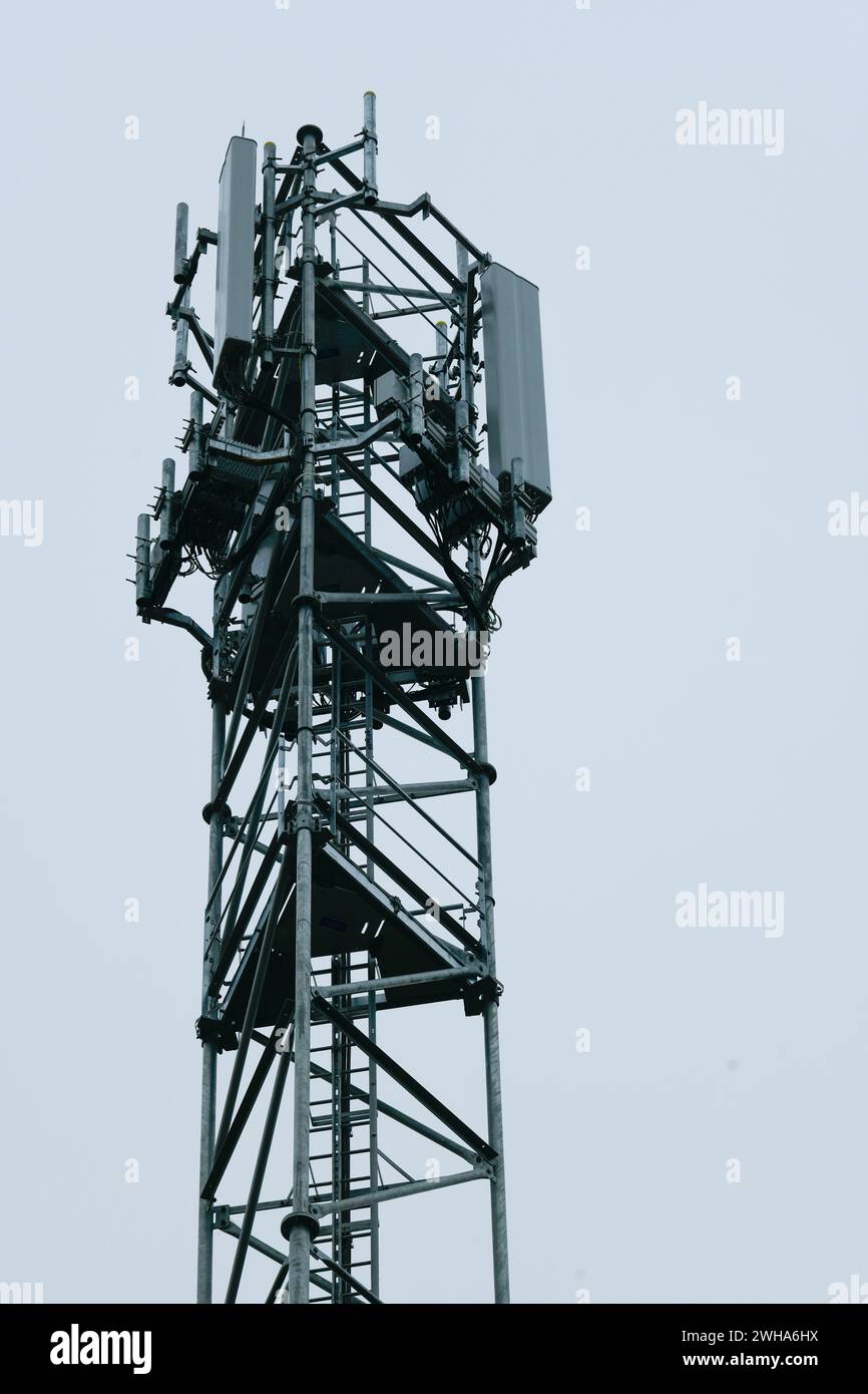 Deployment of the 5G network. Laying antennas on a mobile phone mast in the winter atmosphere ...