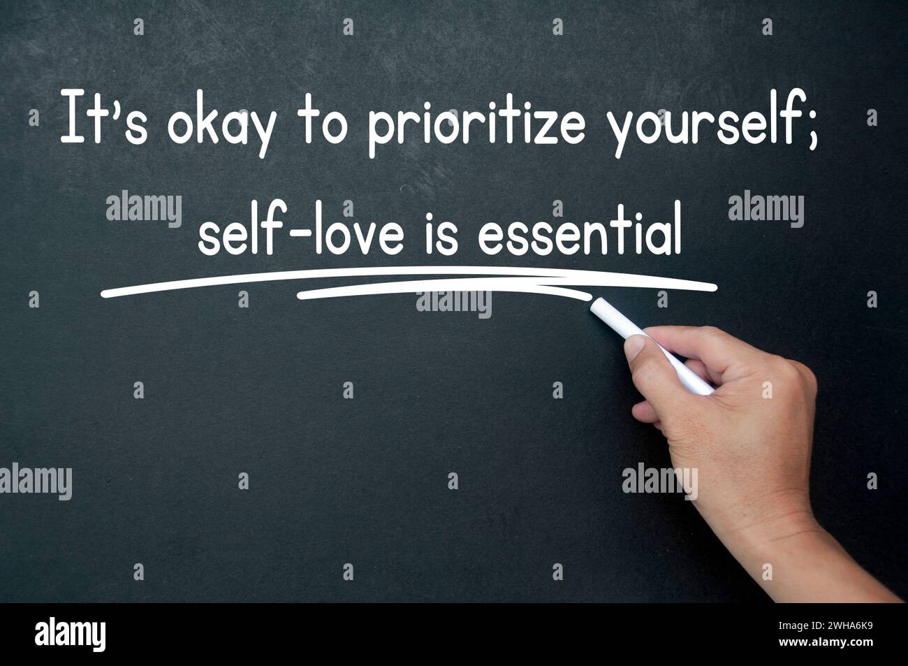 Hand writing It is okay to prioritize yourself affirmation on black ...