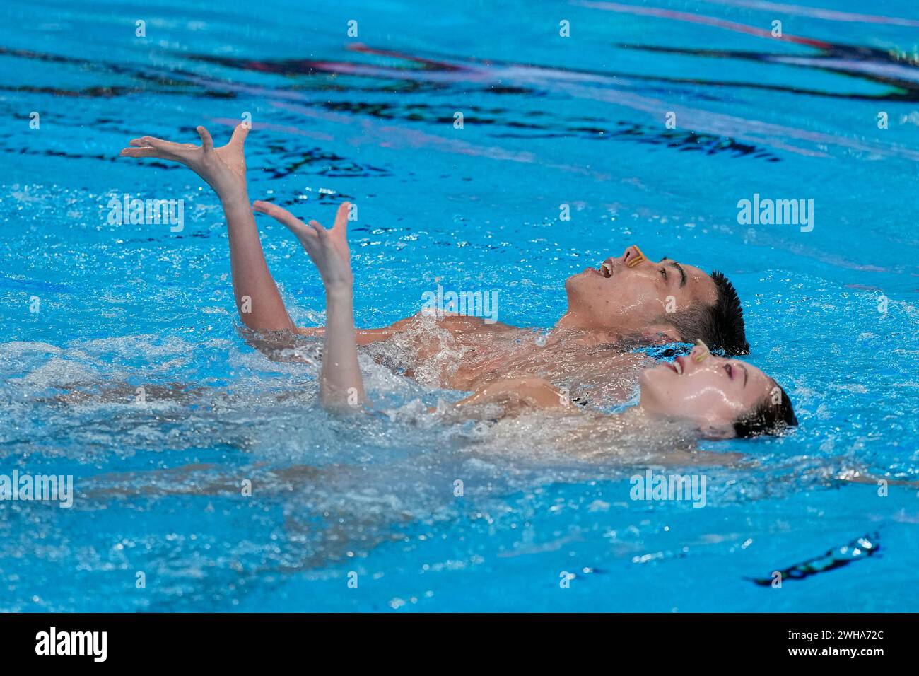 Shi Haoyu and Cheng Wentao, of China, compete in the mixed duet free of ...