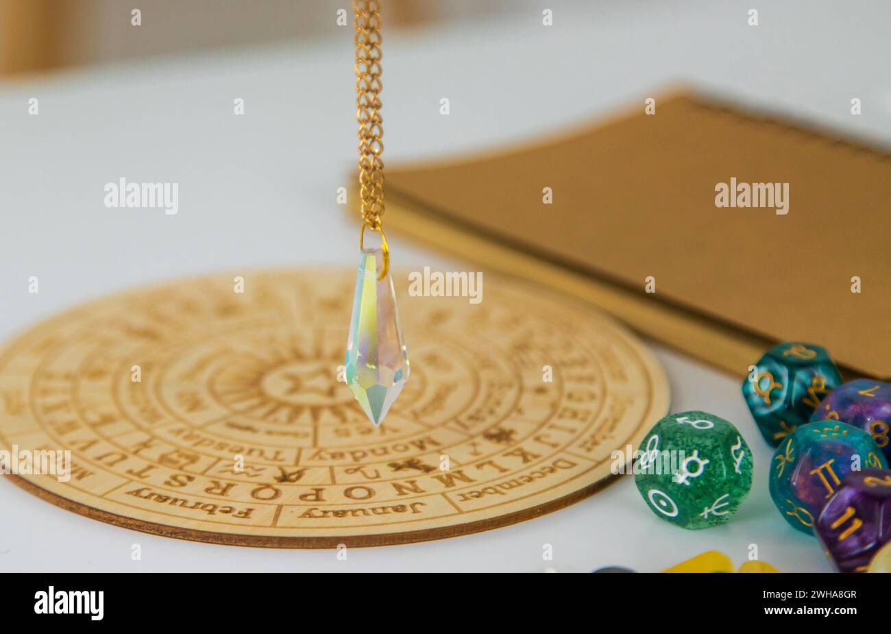 Pendulum numerologist astrologer and zodiac signs. Selective focus ...