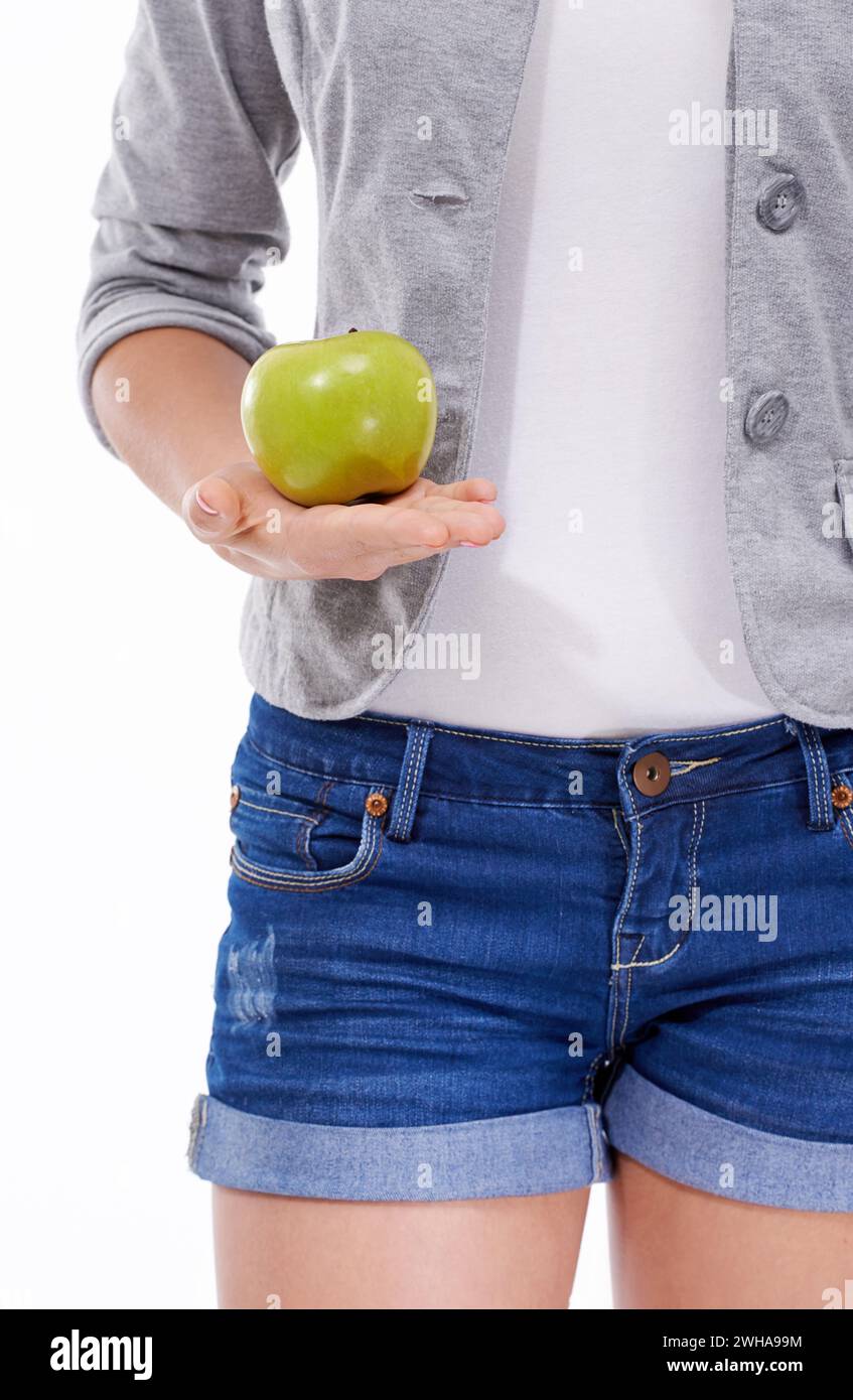 Body, apple or hand of woman with a healthy choice for digestion ...