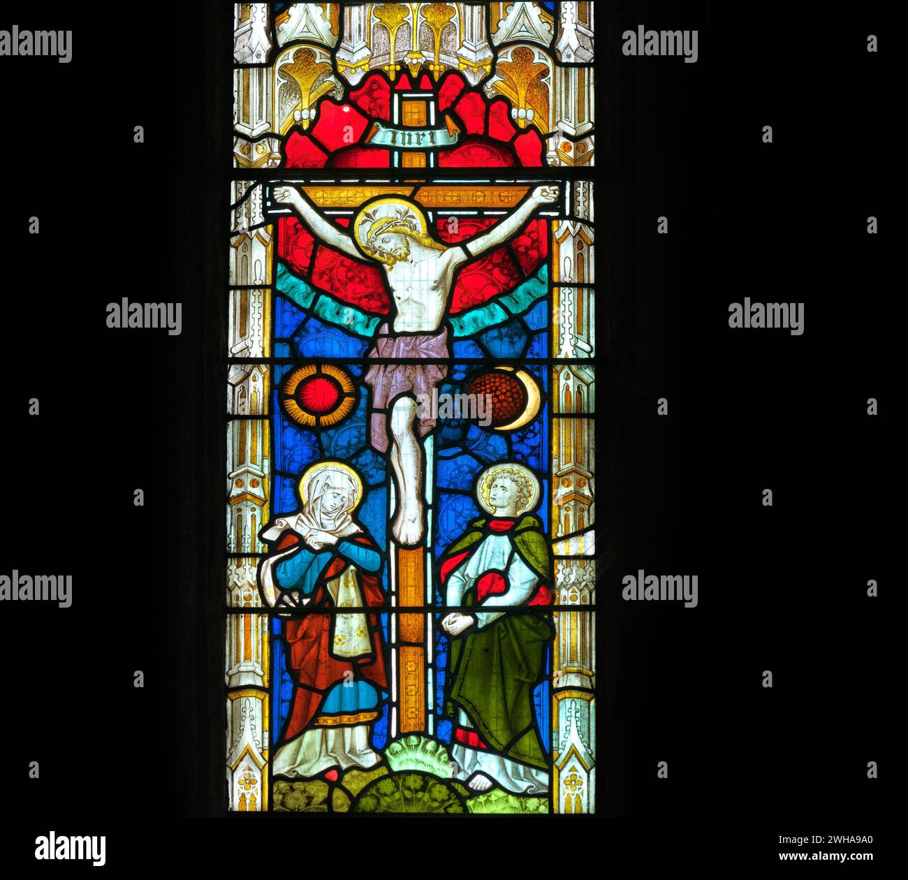 Jesus Christ crucified whilst his mother Mary and his disciple John stand at the foot of the ...