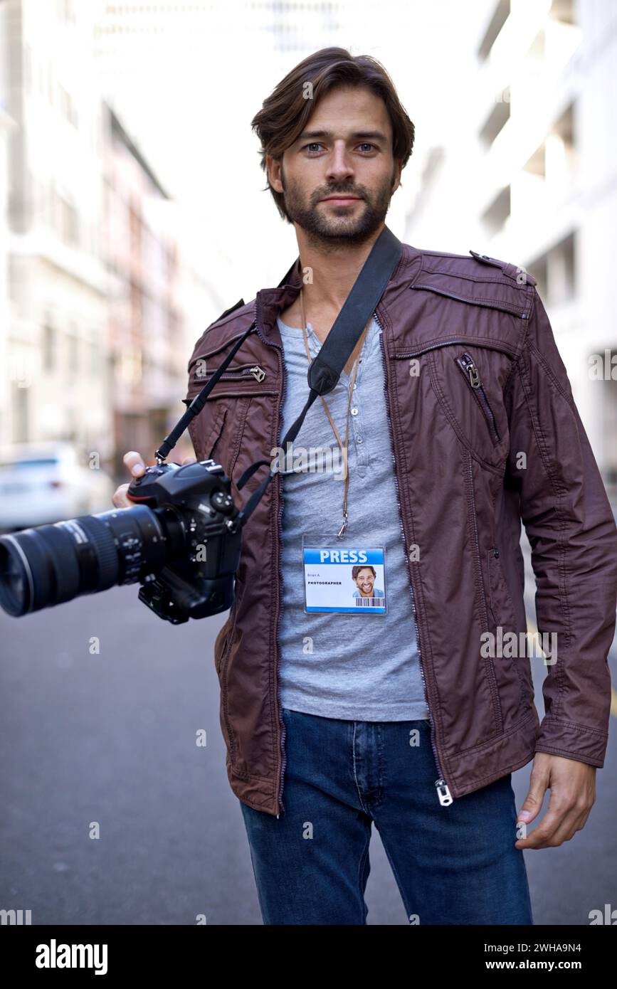 Press, photographer and portrait with camera outdoor in city for ...