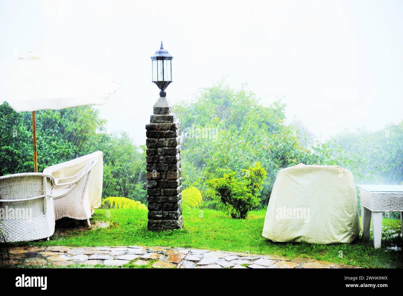 Table and chairs in rain, Elgin Mount Pandim Hotel, Pemayangtse ...