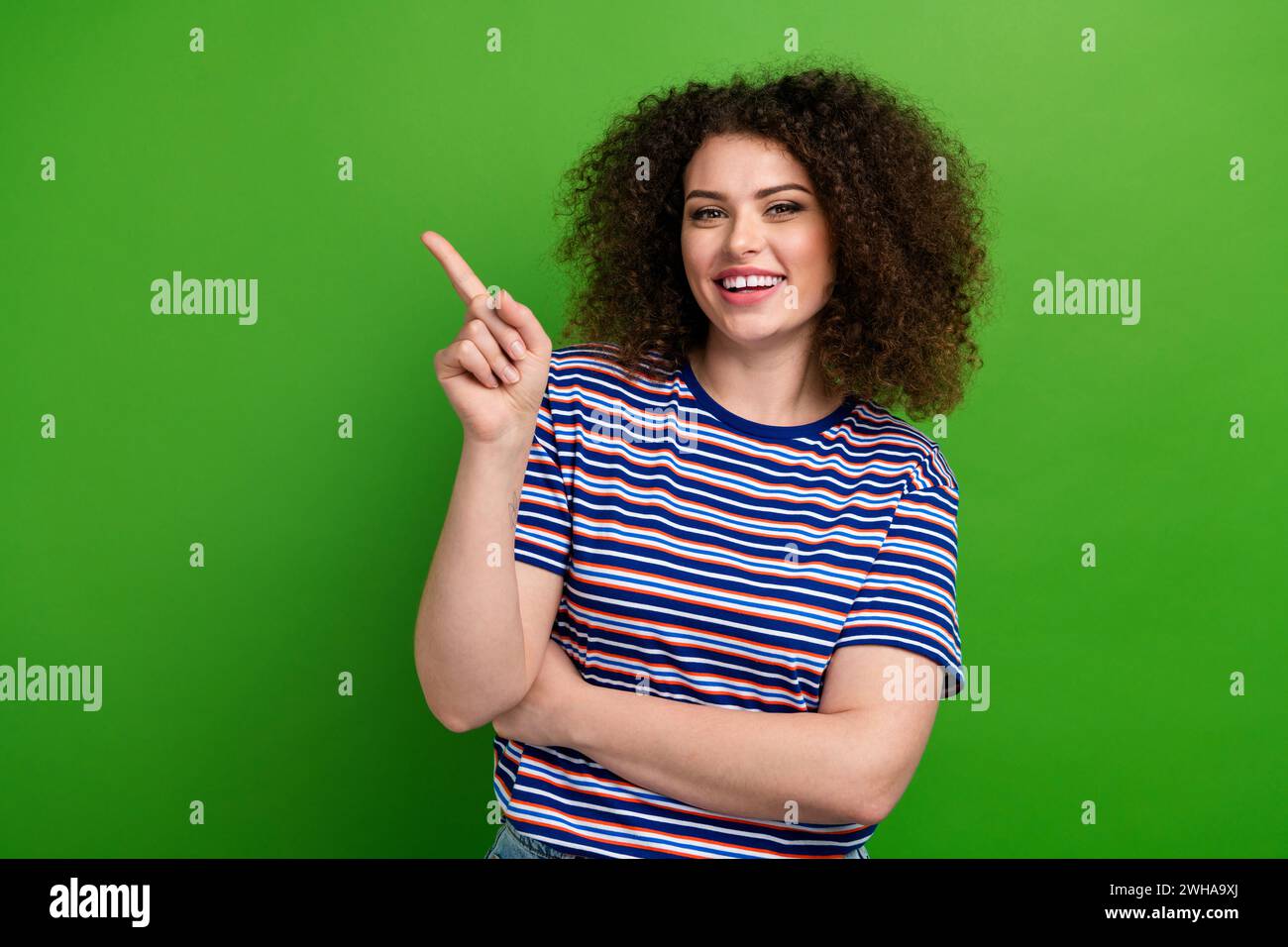 Portrait of pretty cheerful lady toothy smile indicate finger empty ...