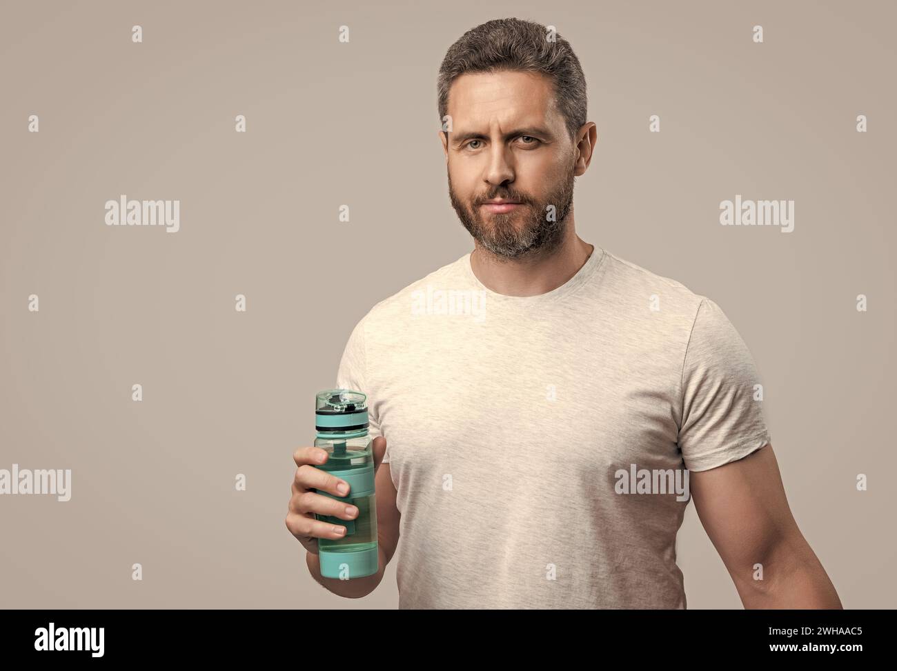 thirsty man feel thirst drinking water isolated on grey. thirsty man ...