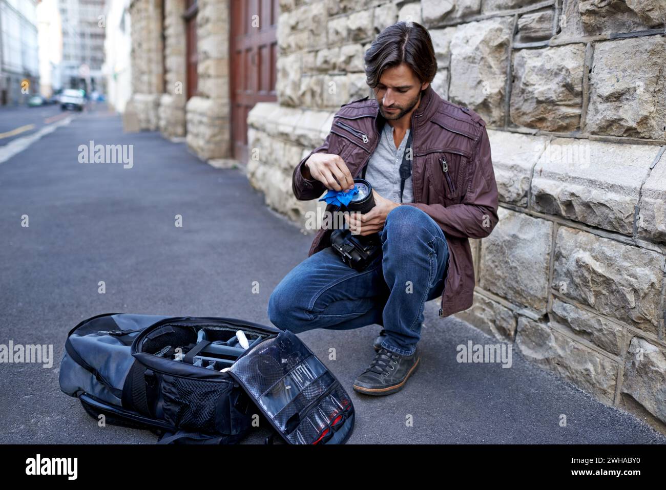 Clean, camera lens and photographer work with equipment outdoor and ...