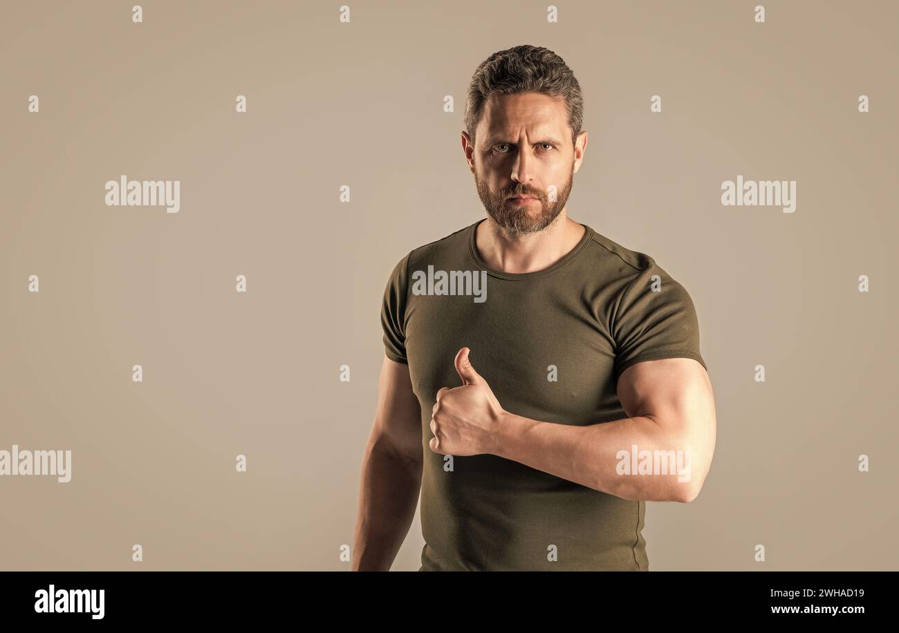 guy approval with thumb up gesture wear tshirt. muscular guy approval ...