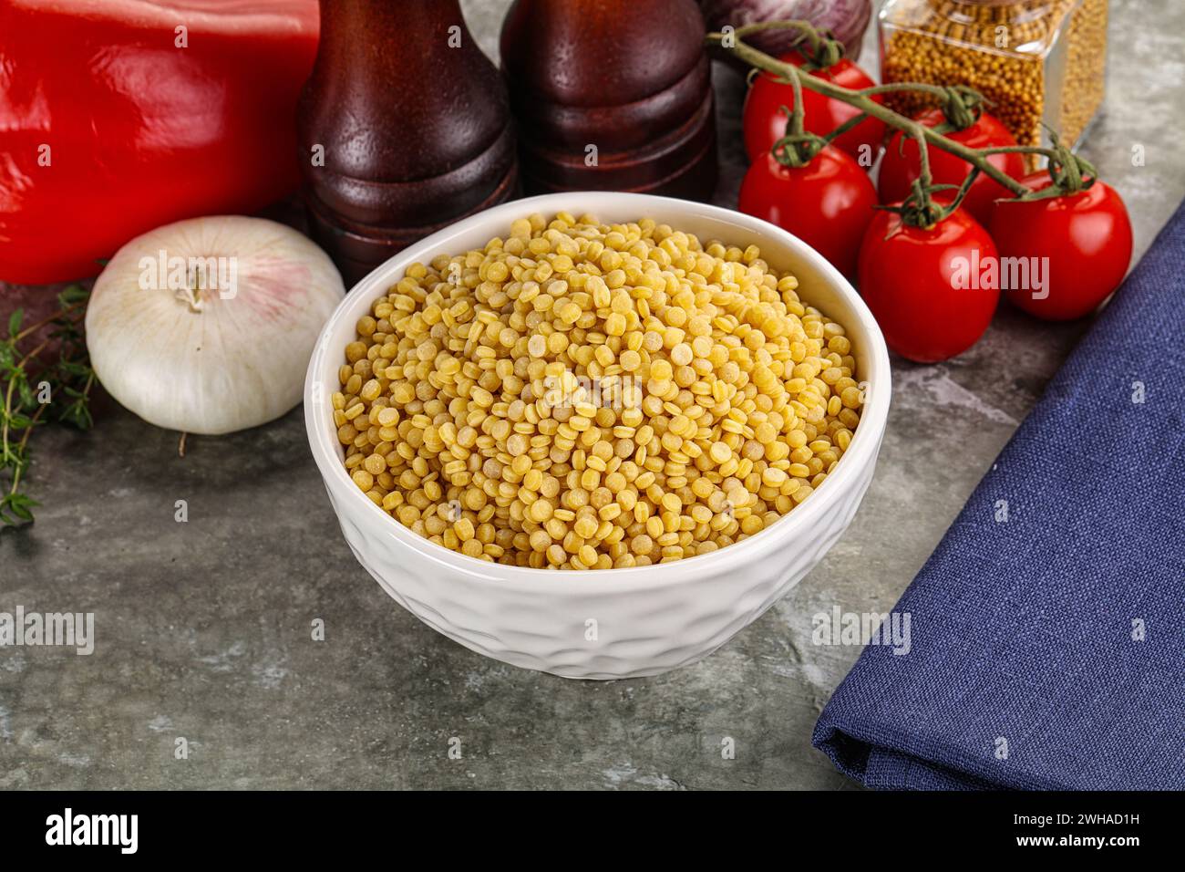 Dry ptitim heap in the bowl for cooking Stock Photo - Alamy
