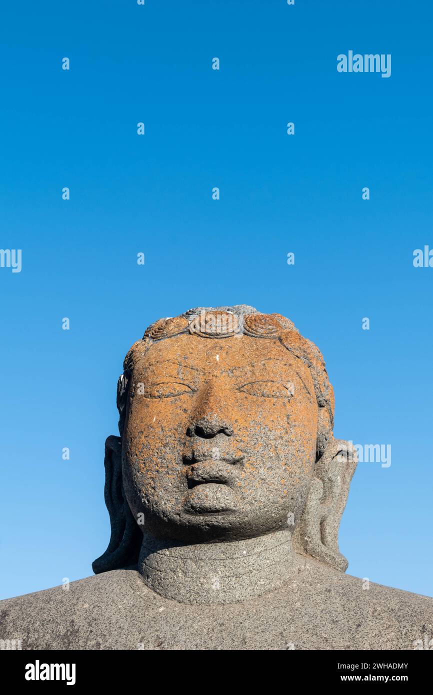 The colossal statue of Gommateshwara Bahubali stands tall against a ...