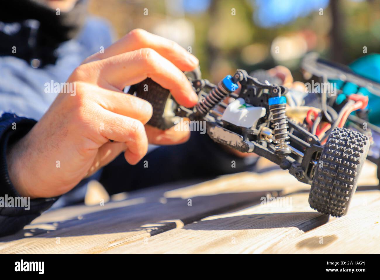 A child playing with a remote-controlled gas-powered toy car Stock ...