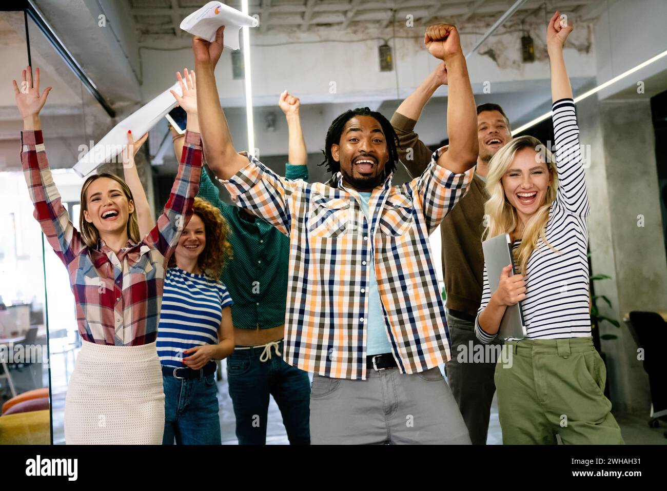 Happy diverse employees team celebrating success, business achievement Stock Photo - Alamy