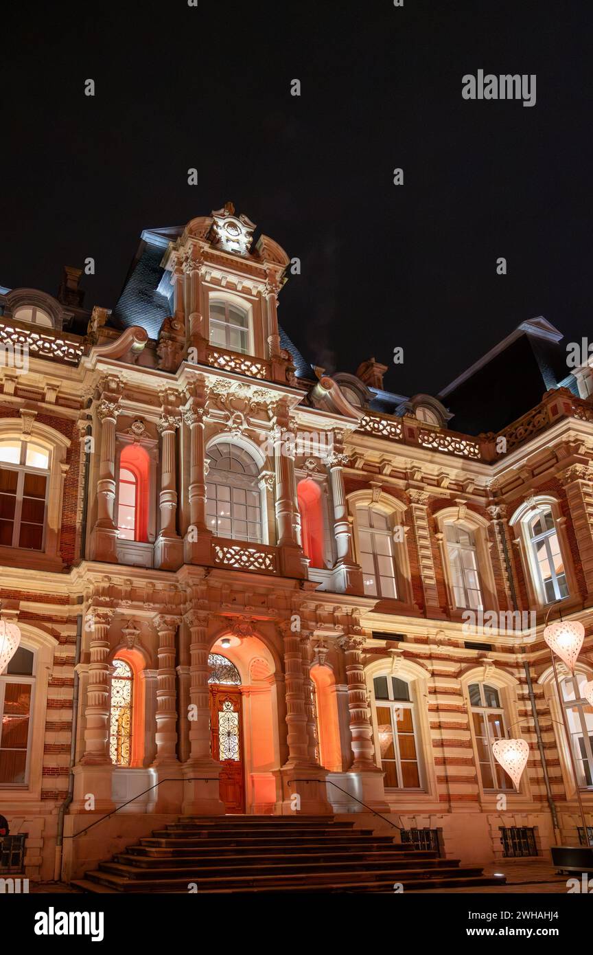 Illuminated glass windows of traditional French house at night, Epernay ...