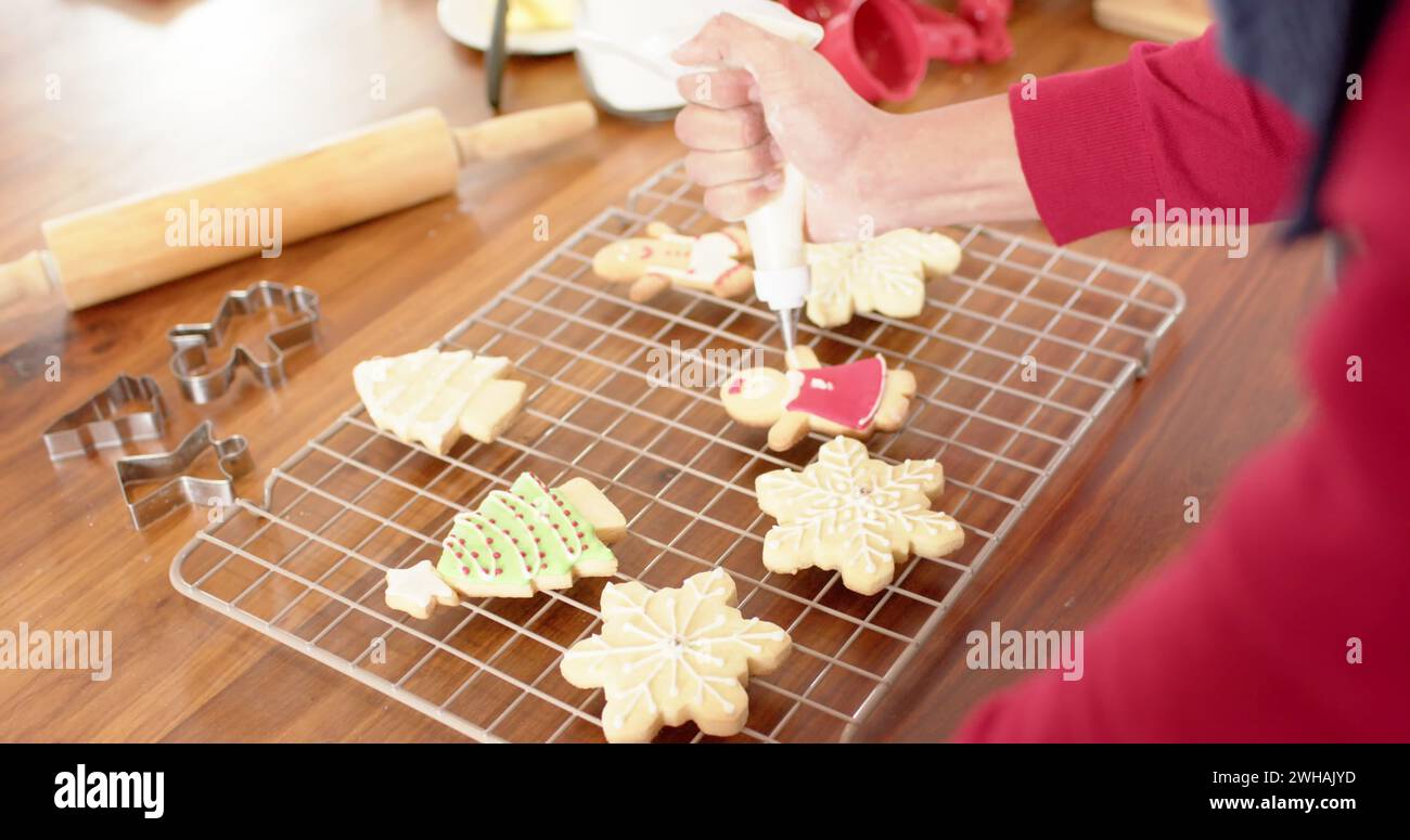 Person decorating cookies at home, with copy space Stock Photo - Alamy
